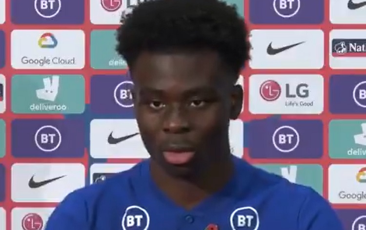 Arsenal's Bukayo Saka on Tottenham Hotspur's Harry Kane helping him ...